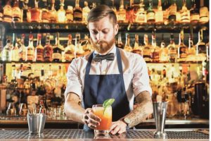 Why Do Bartenders Wear Aprons? Unveiling the Practical Reasons - Bartender Training